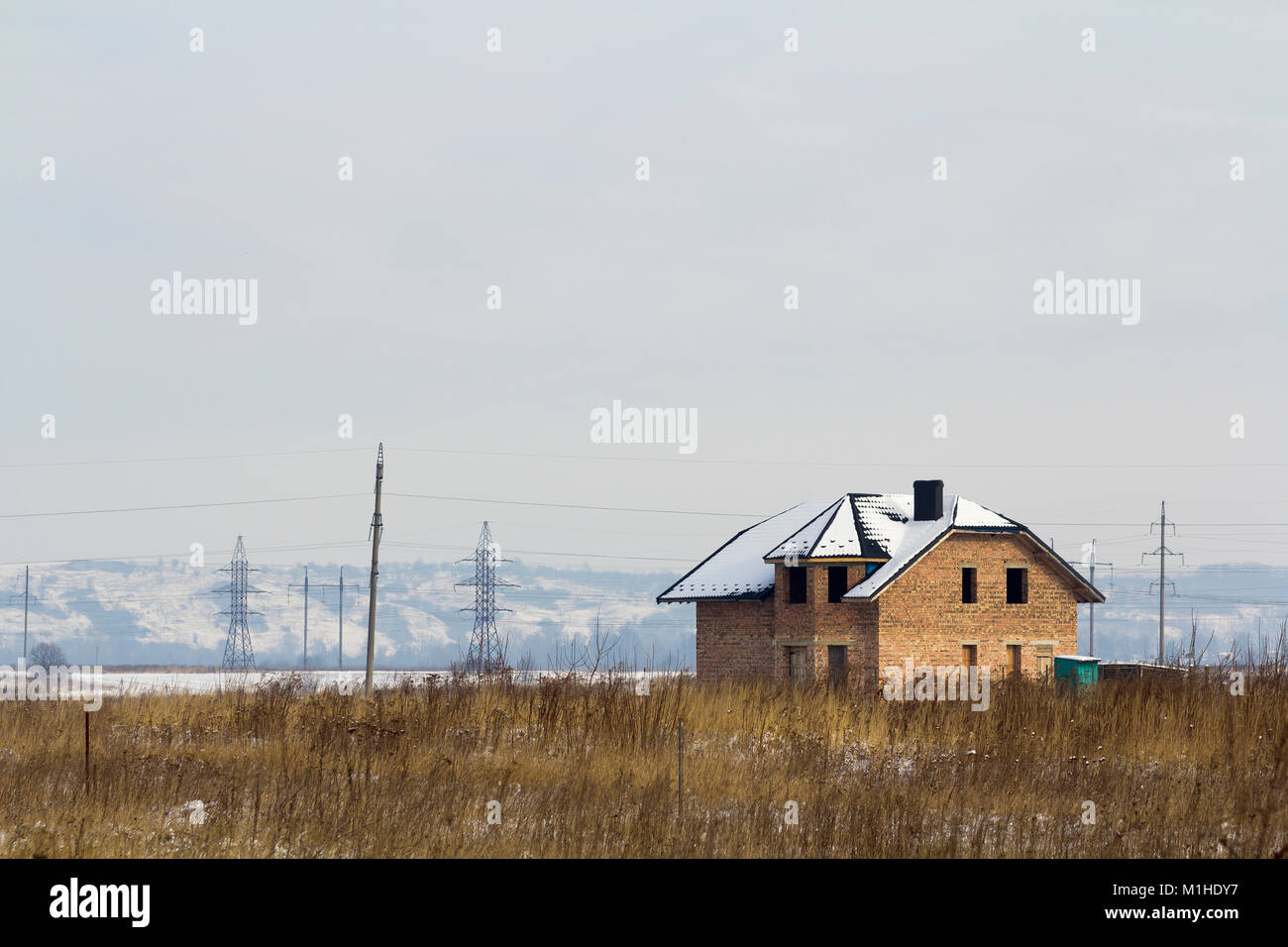 Private modern two-storey house under construction without a fence in a ...