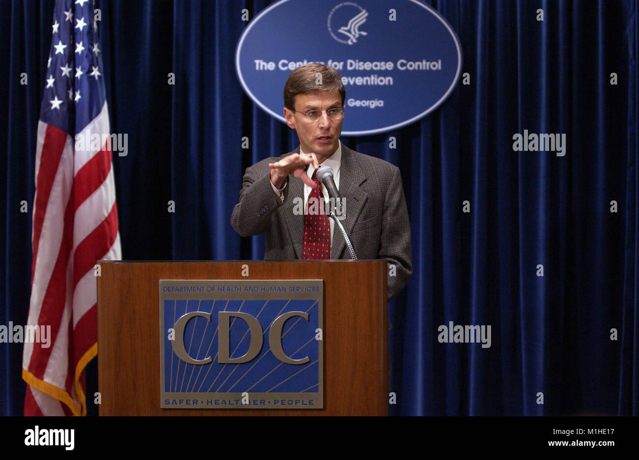 Photograph of Dr. David Fleming speaking at an official CDC media event ...