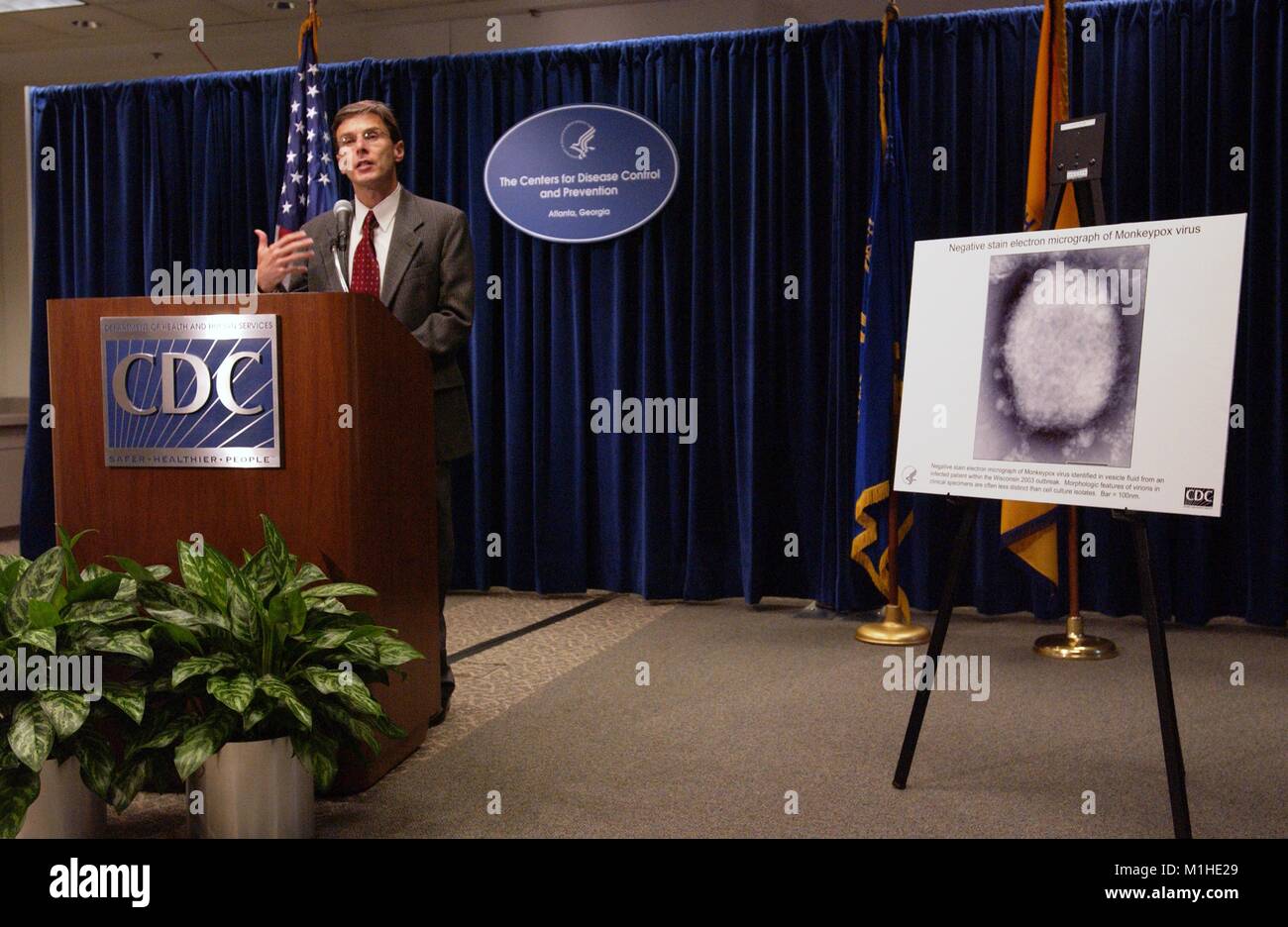 Photograph of Dr. David Fleming addressing the press at a CDC briefing ...