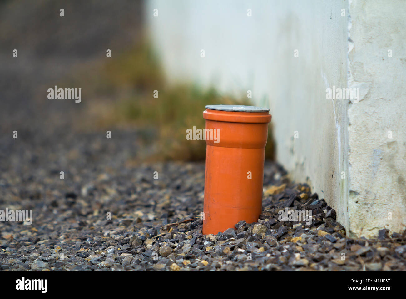 Drainage pipe in the recess of the gutter. Pipe for the water sticking ...