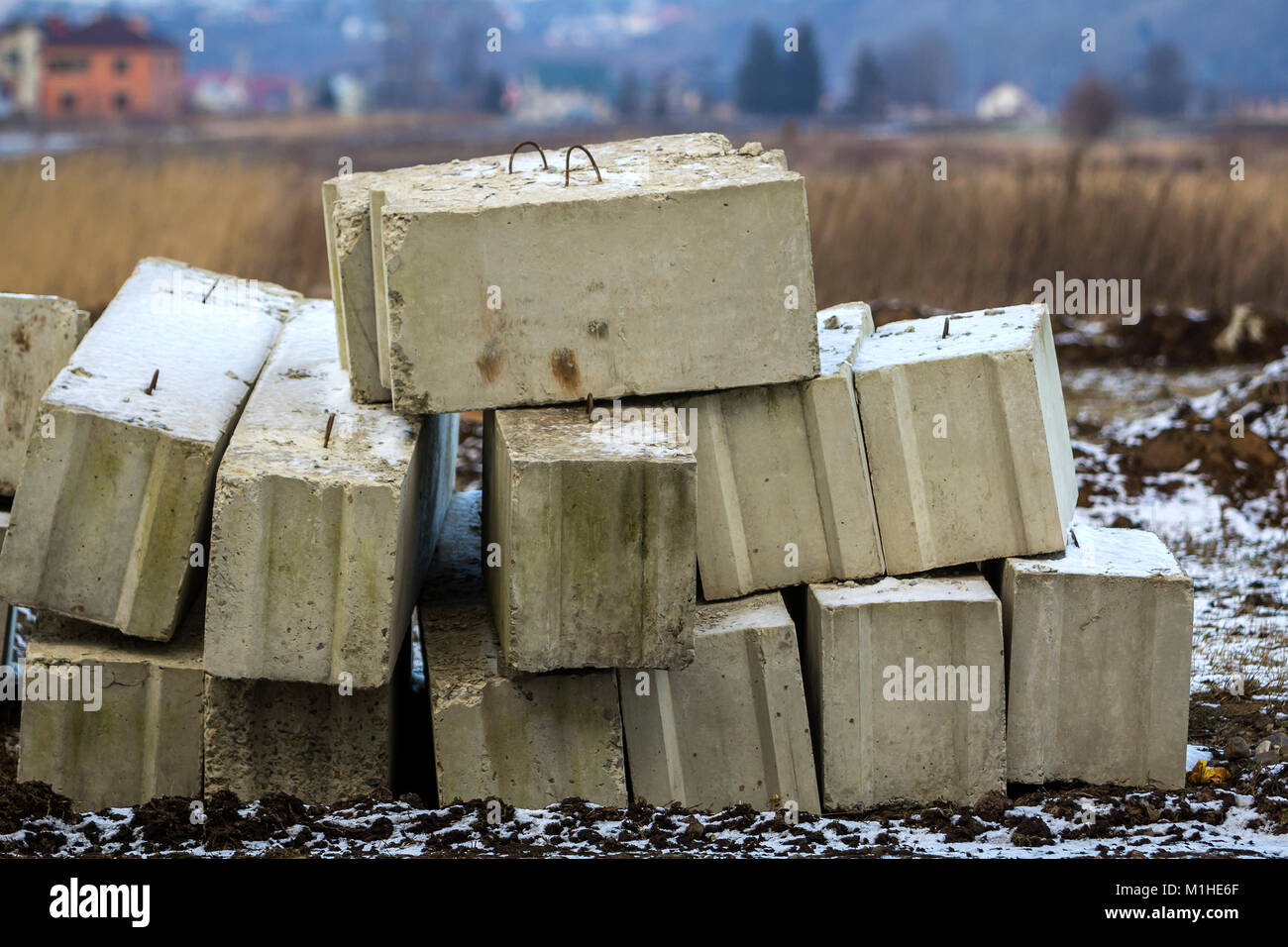 Stack of concrete blocks for foundation on construction site ...