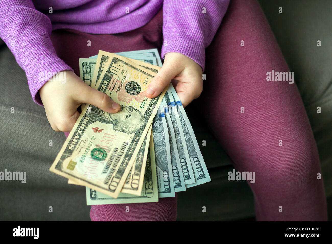 Money, finances and people concept - smiling little girl with dollar ...