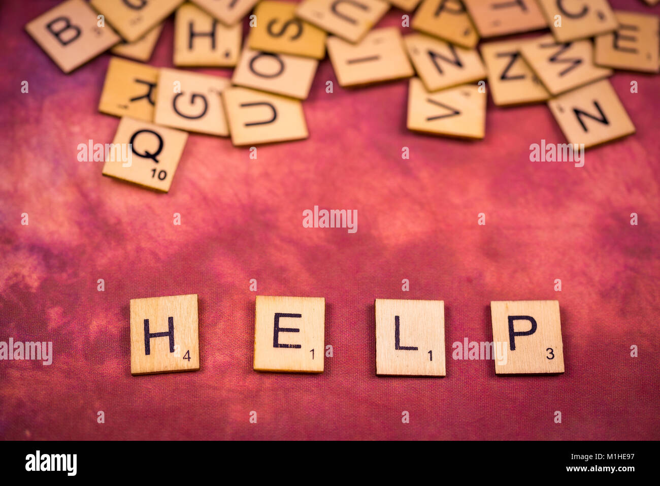 Concept of Alphabet wooden letters with letters forming word : Help ...