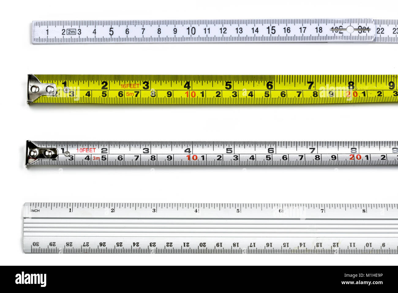 Four kinds of tape measure on a white background and different angle ...