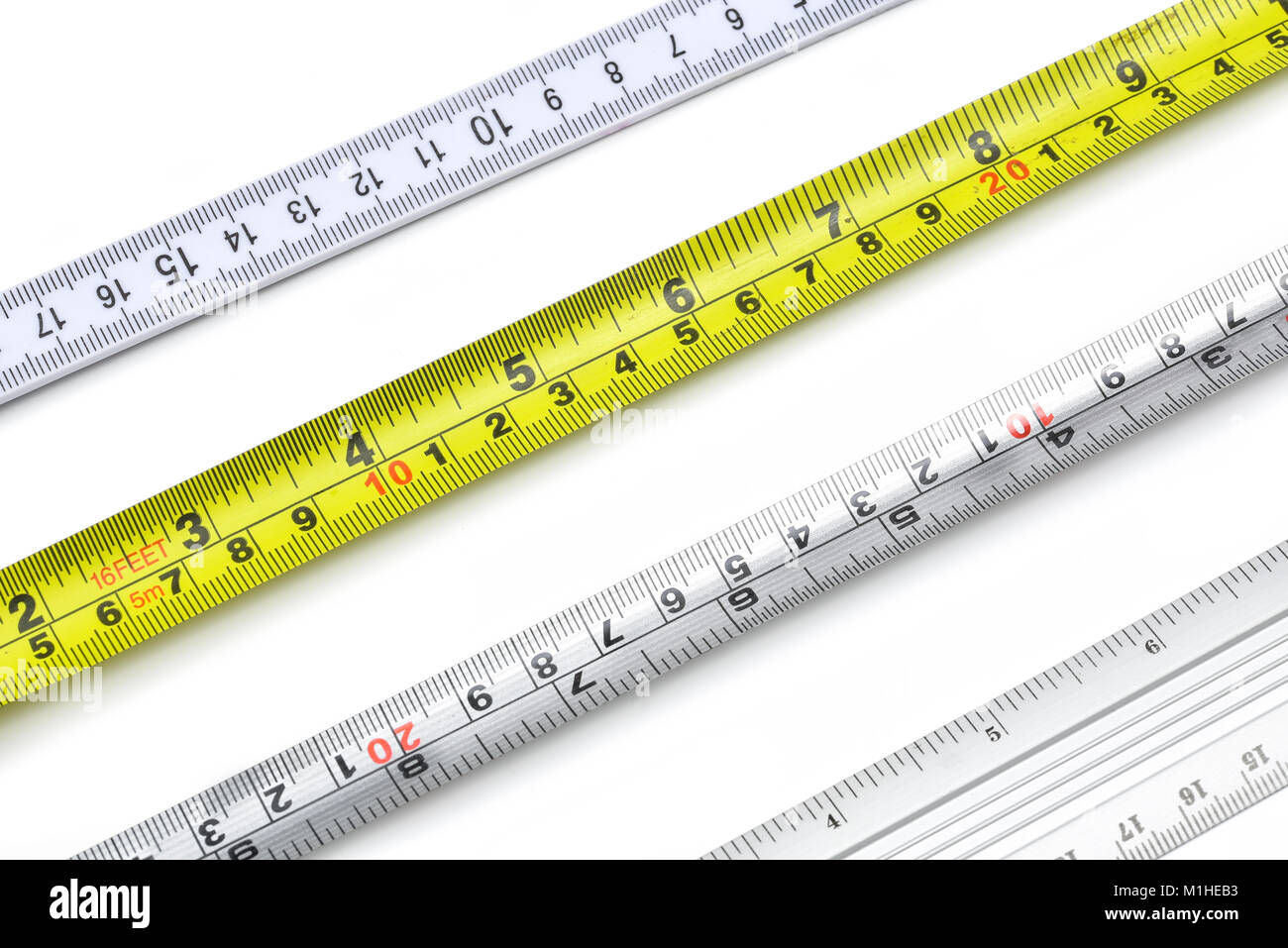 Four kinds of tape measure on a white background and different angle ...