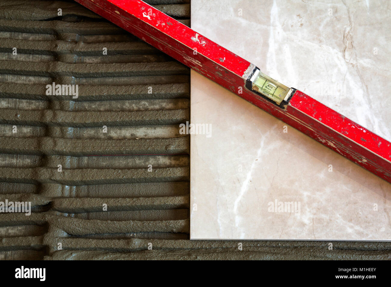 Ceramic tiles and tools for tiler. Floor tiles installation. Home ...