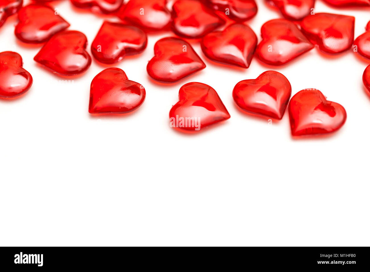 Red love hearts on a plain white background Stock Photo - Alamy