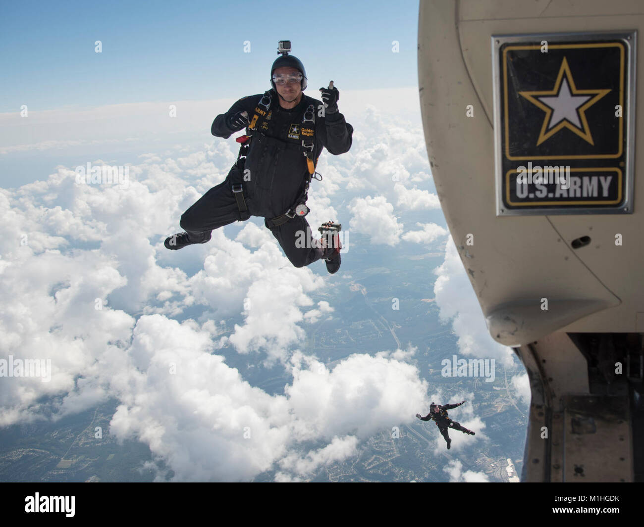 U.S. Army Parachute Team “Golden Knights” members jump out of a C-31 ...