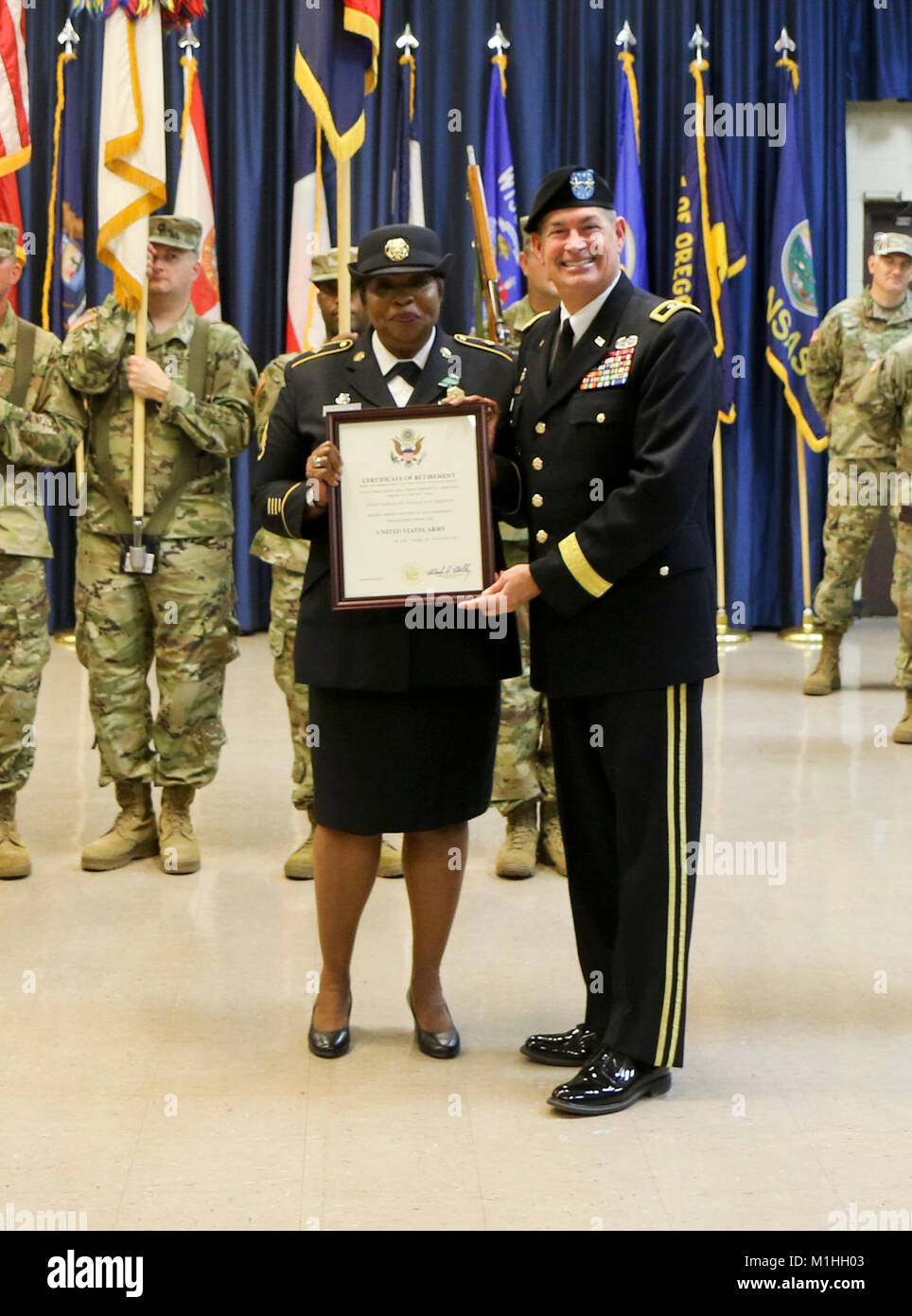 Staff Sgt. Wanda Barron is congratulated with a certificate of ...
