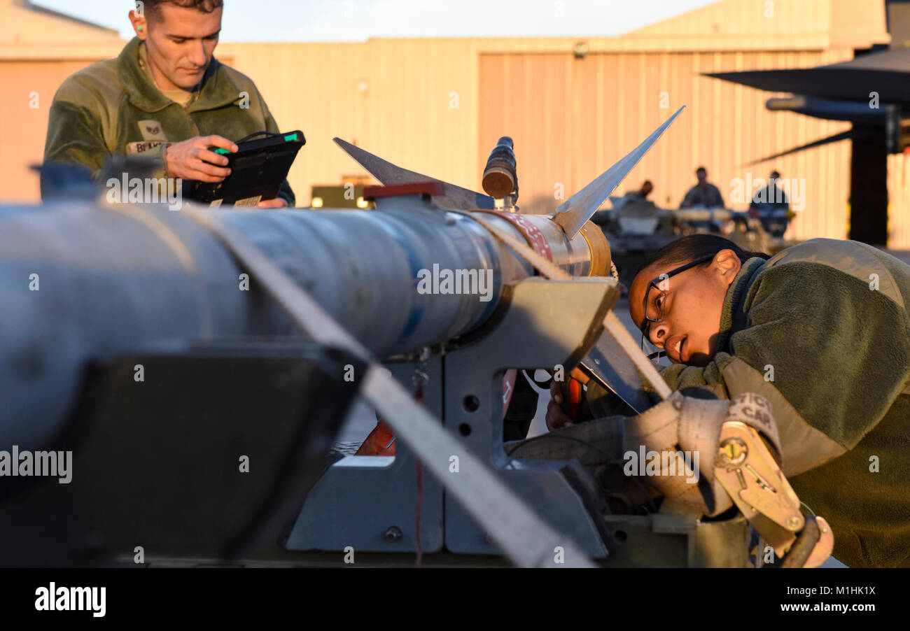 Airmen from the 57th Maintenance Group perform an inspection on an AIM ...