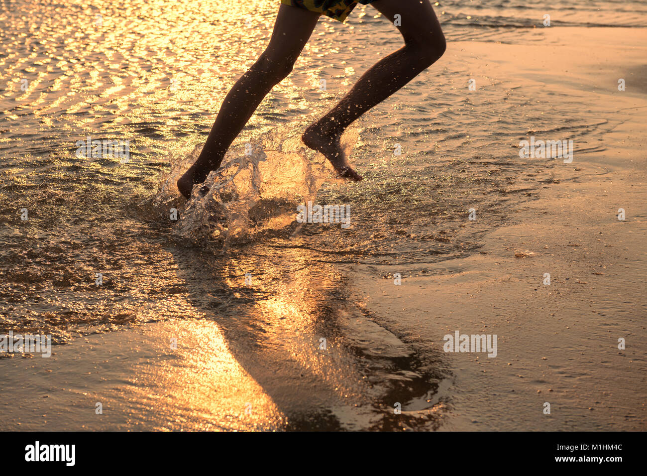 Male athlete beach running hi-res stock photography and images - Alamy