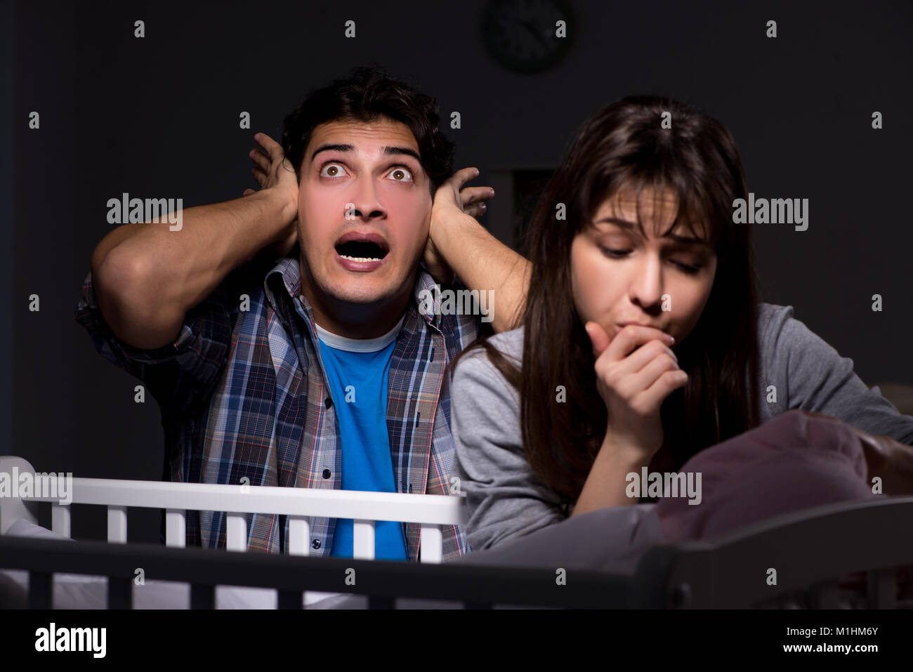 Young parents sleepless with newborn baby at night Stock Photo - Alamy