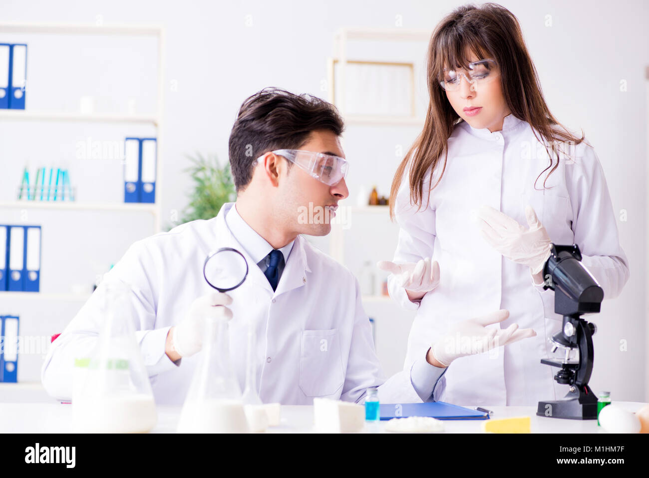 Two lab doctor testing food products Stock Photo - Alamy