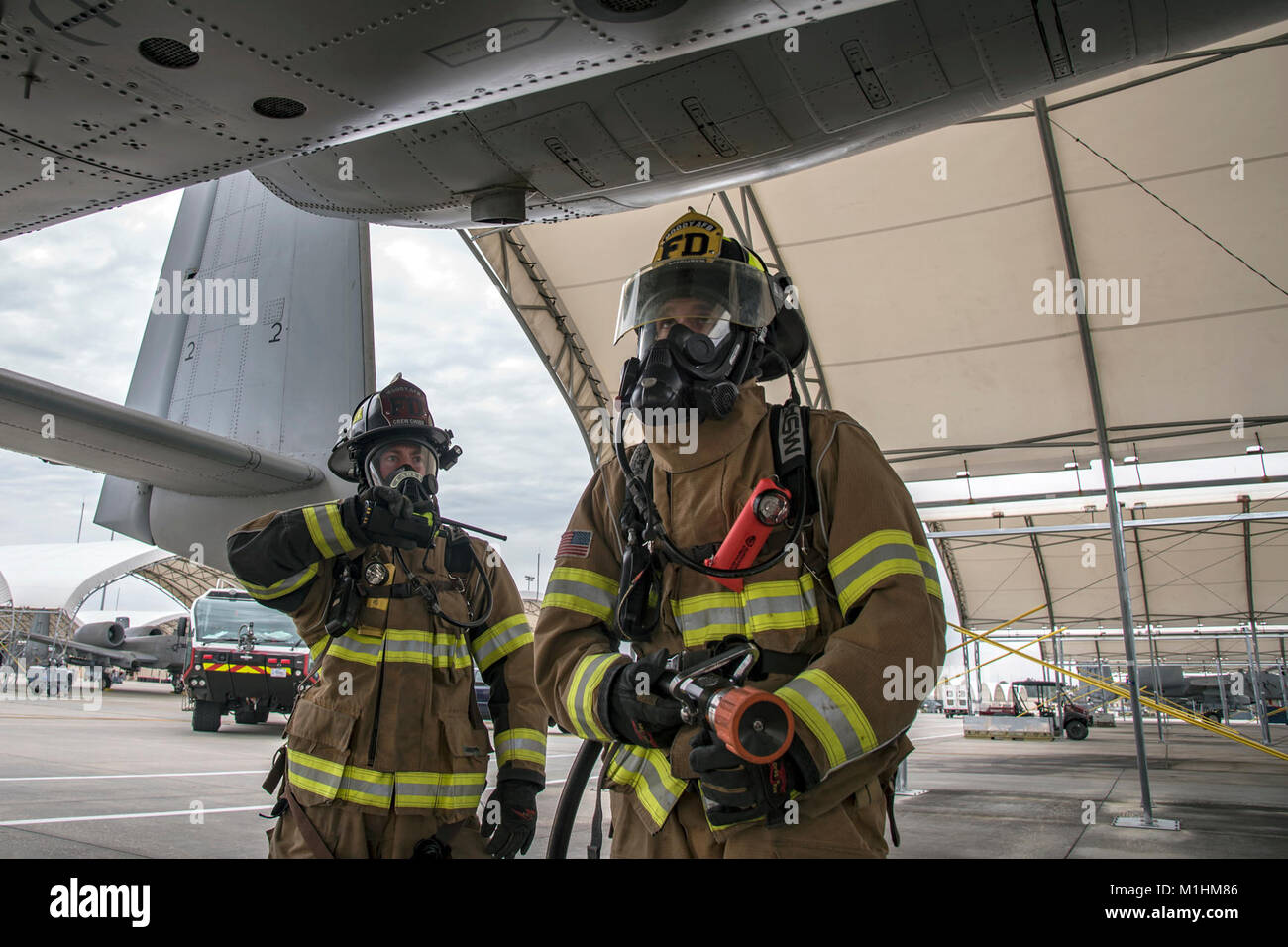 Firefighters from the 23d Civil Engineer Squadron (CES) inspect the ...