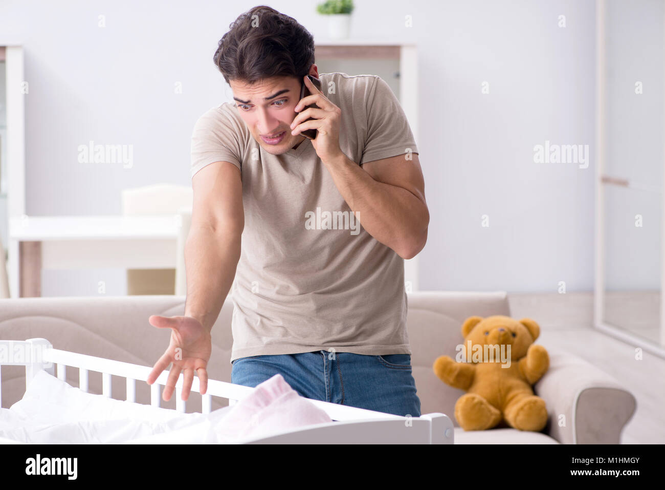 Young father dad frustrated at crying baby Stock Photo - Alamy
