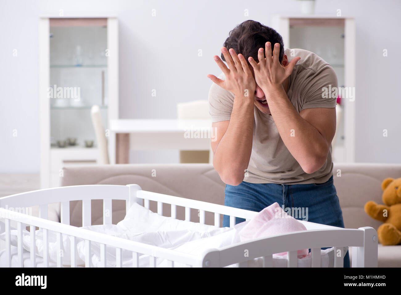 Young father dad frustrated at crying baby Stock Photo - Alamy