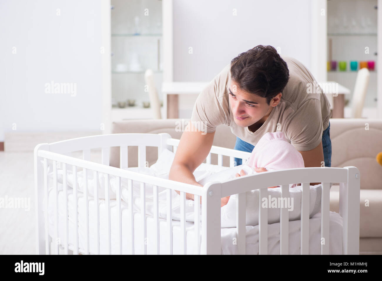 Young father dad frustrated at crying baby Stock Photo - Alamy