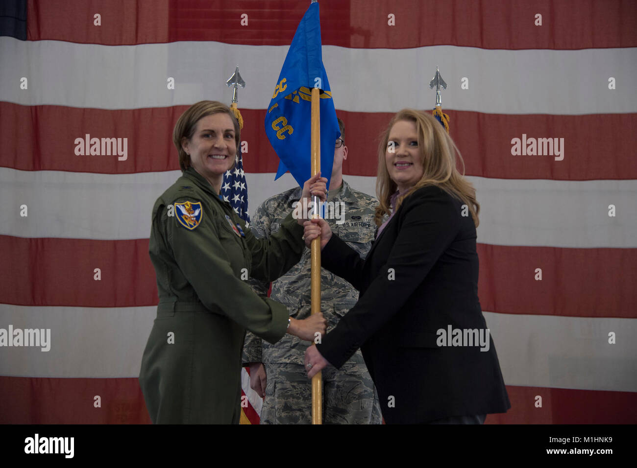 Col. Jennifer Short, 23d Wing commander, hands Paige Dukes, incoming ...