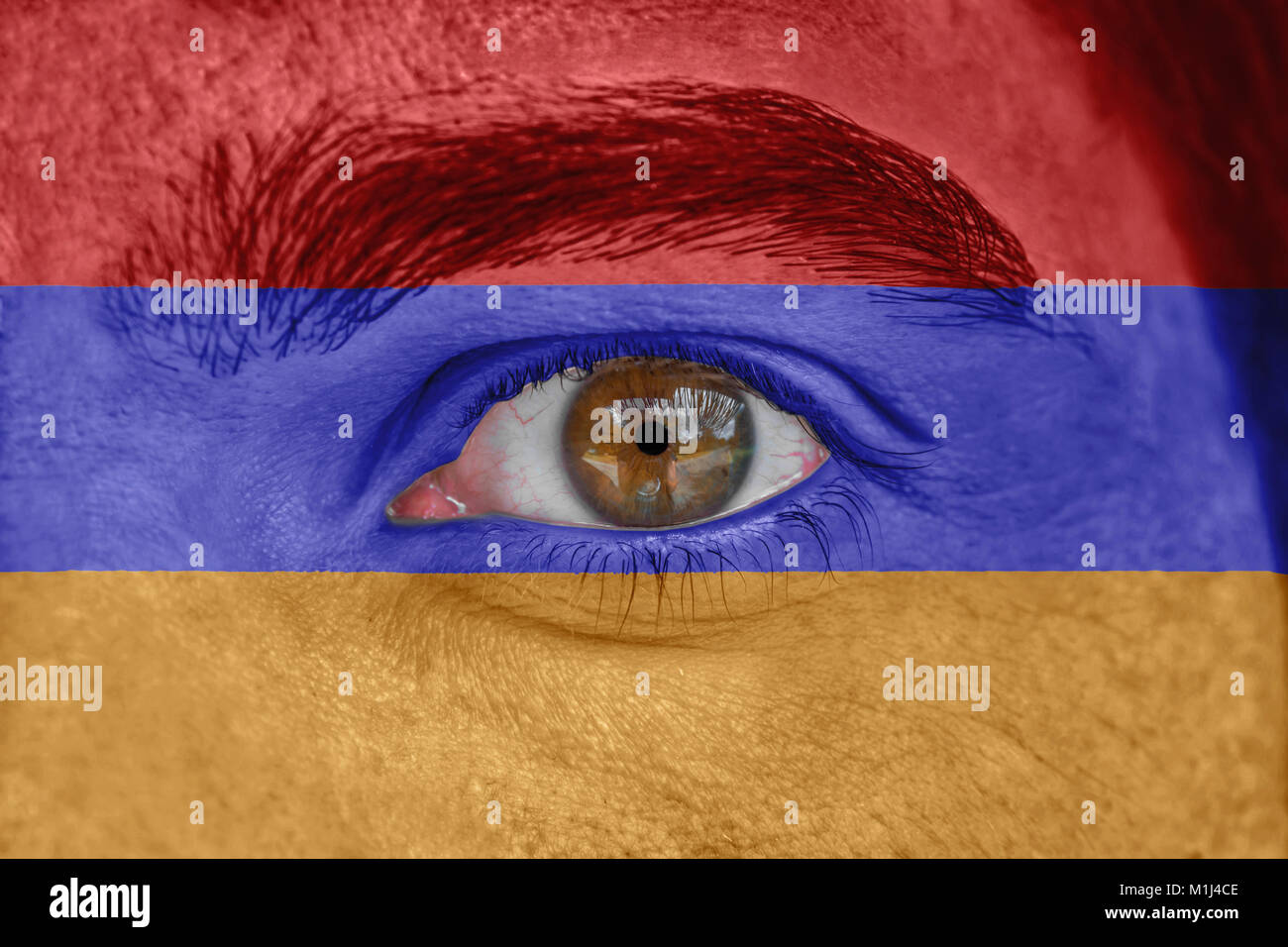 Human face and eye painted with flag of Armenia Stock Photo - Alamy