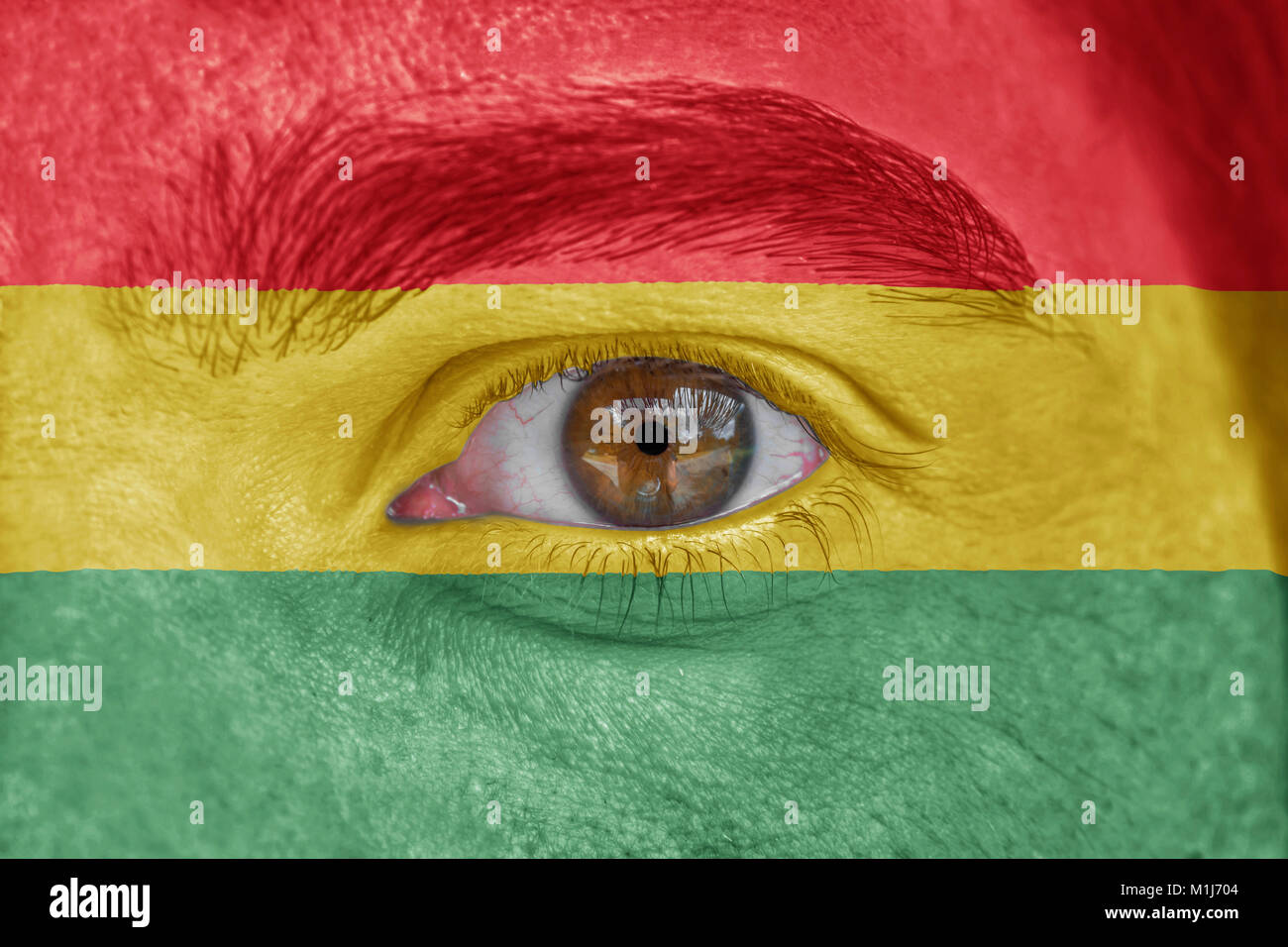 Human face and eye painted with flag of Bolivia Stock Photo - Alamy