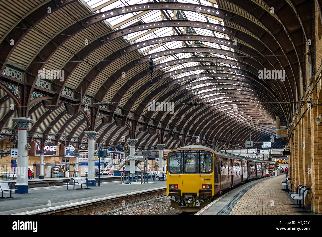 Train in York railway station at a platform ready to depart. Covered by ...