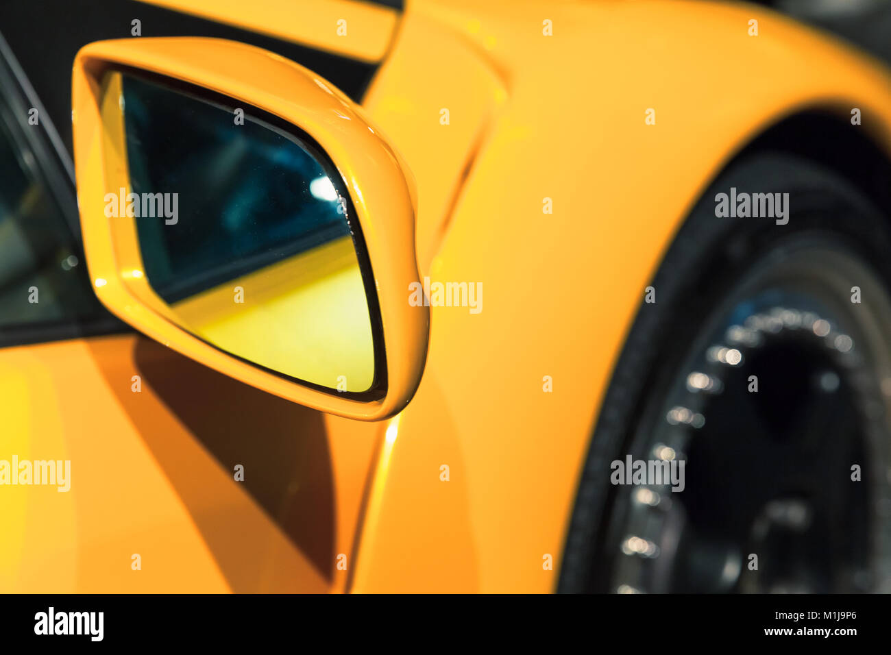 Yellow sports car mirror, close up photo. Italian car design Stock ...