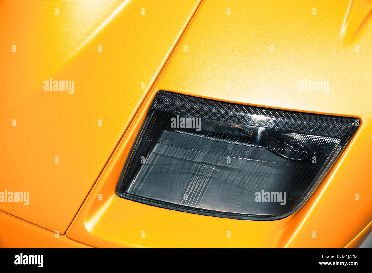 Headlight of luxury yellow roadster, Italian car design Stock Photo - Alamy