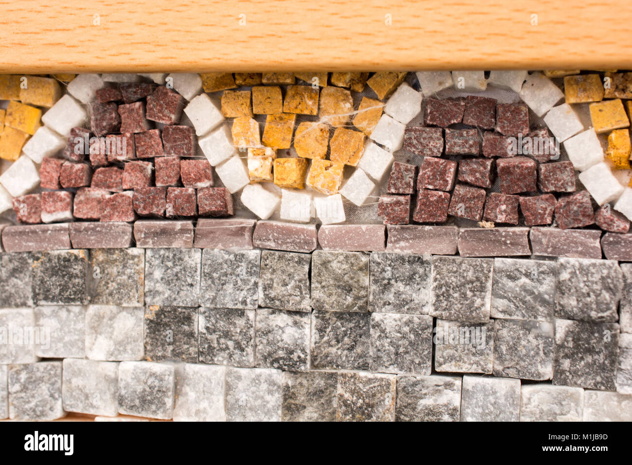 Decorative stone background built of little stones Stock Photo - Alamy