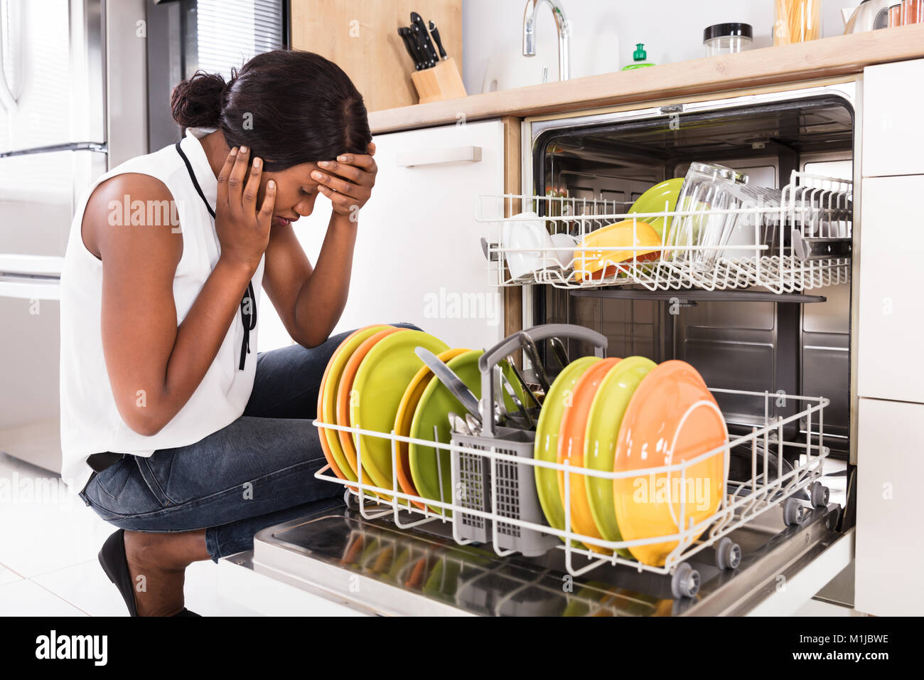 Woman lady female crouching hi-res stock photography and images - Alamy