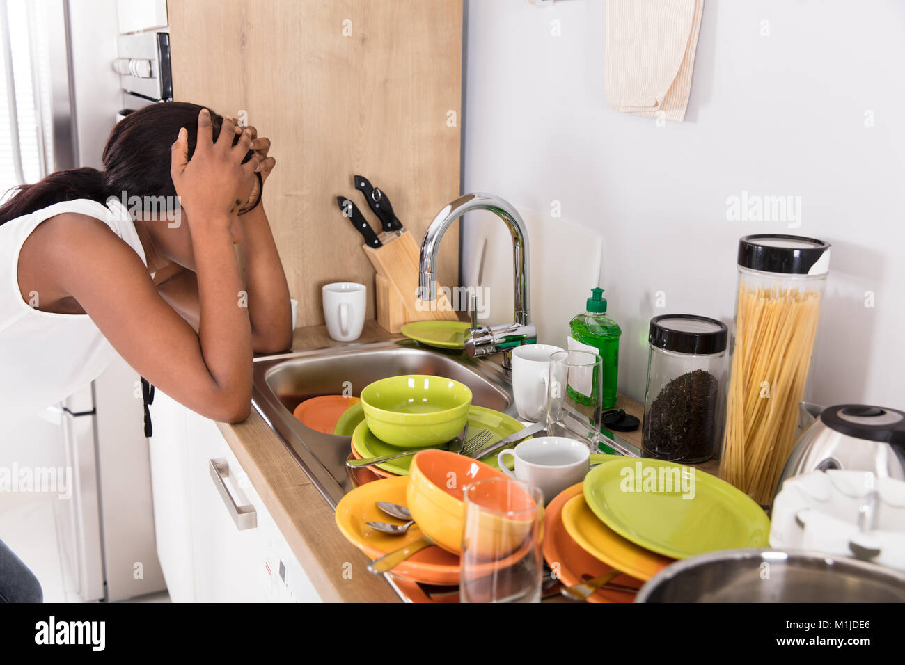 African person cleaning kitchen utensils hi-res stock photography and ...