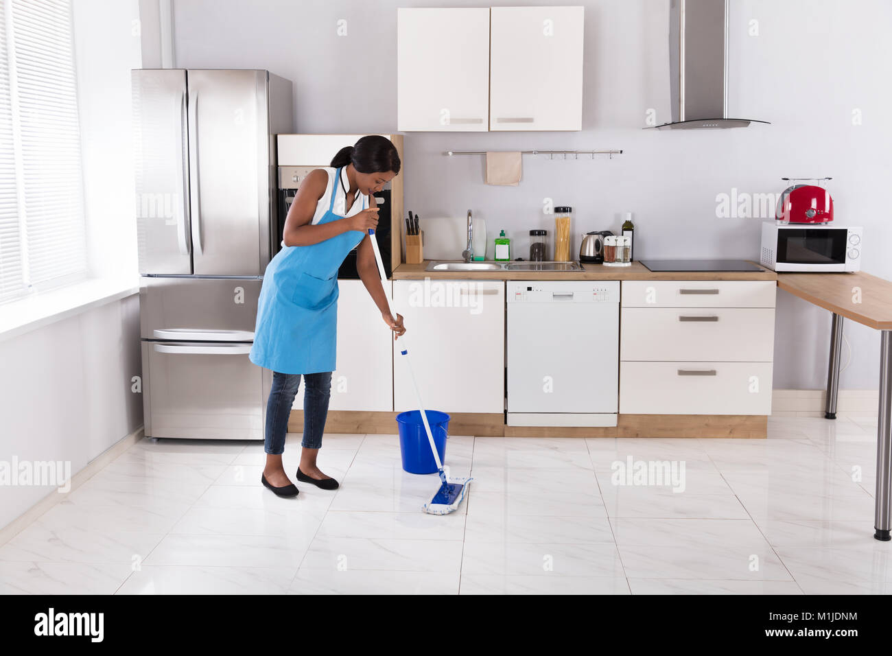 African Woman Sweeping High Resolution Stock Photography and Images - Alamy
