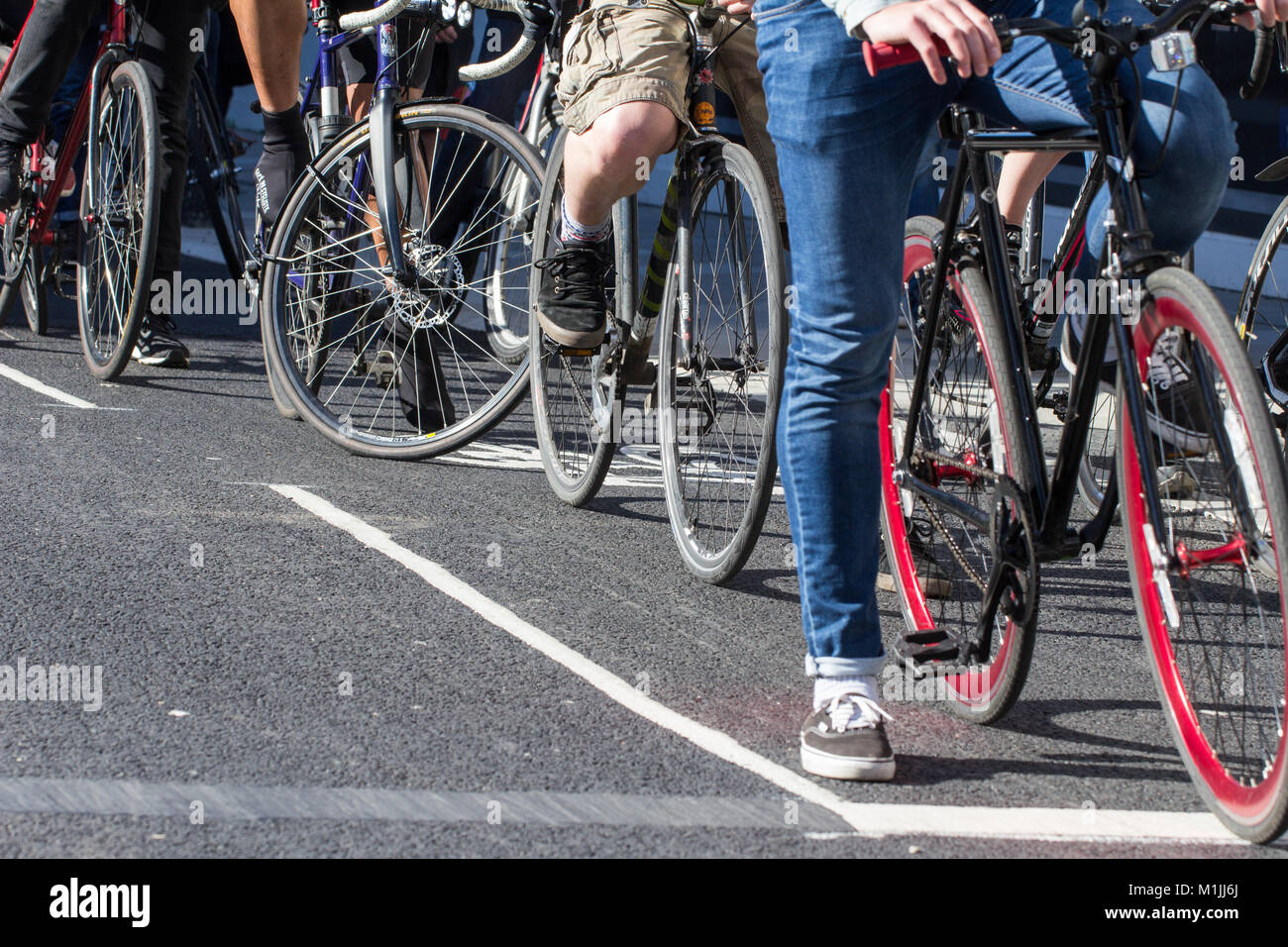 London cyclists cycling to work along a cycle lane Stock Photo - Alamy