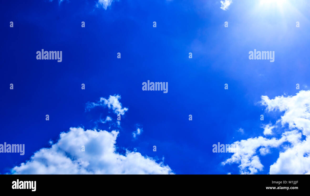 Blue summer sky with sunshine Stock Photo - Alamy
