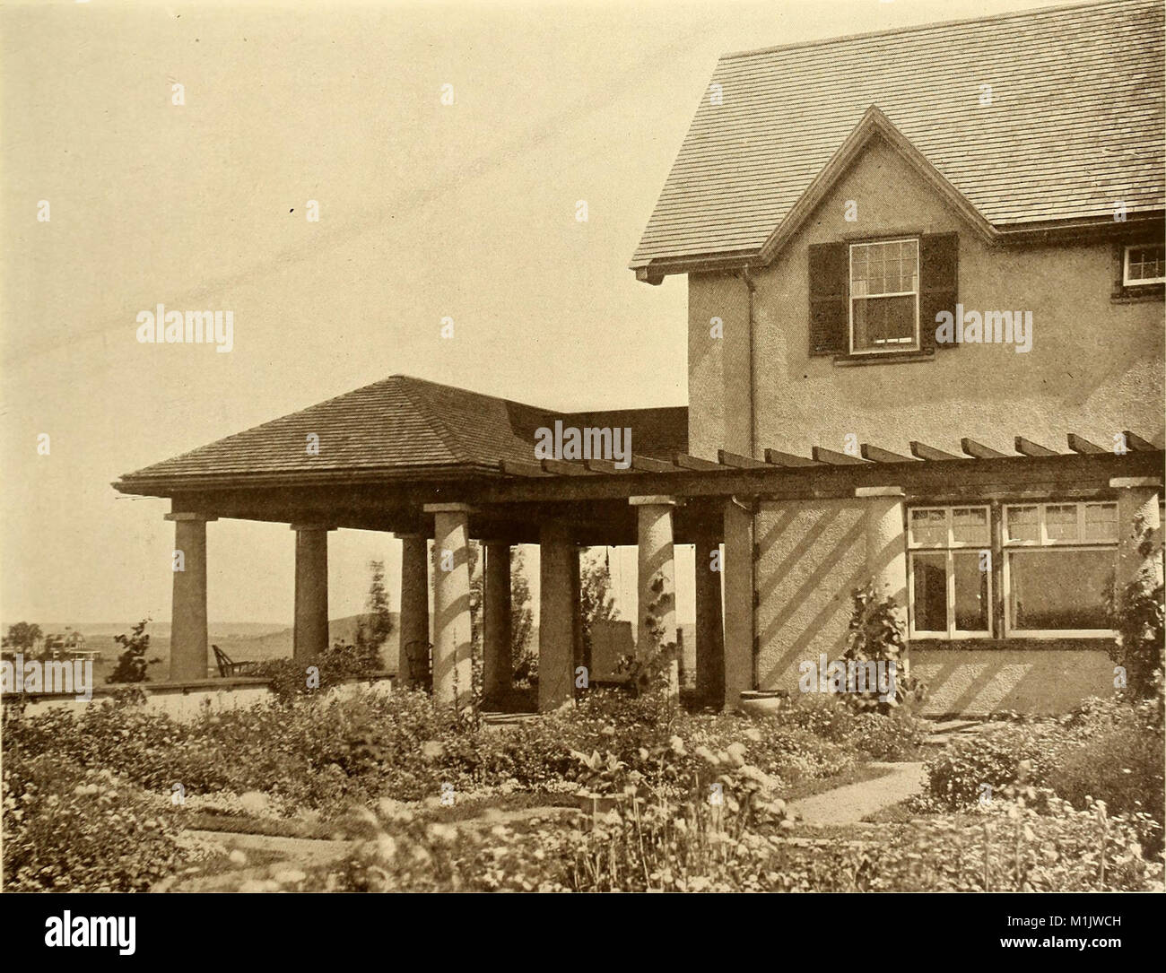 The 1910 publication *American Homes and Gardens* focuses on ...