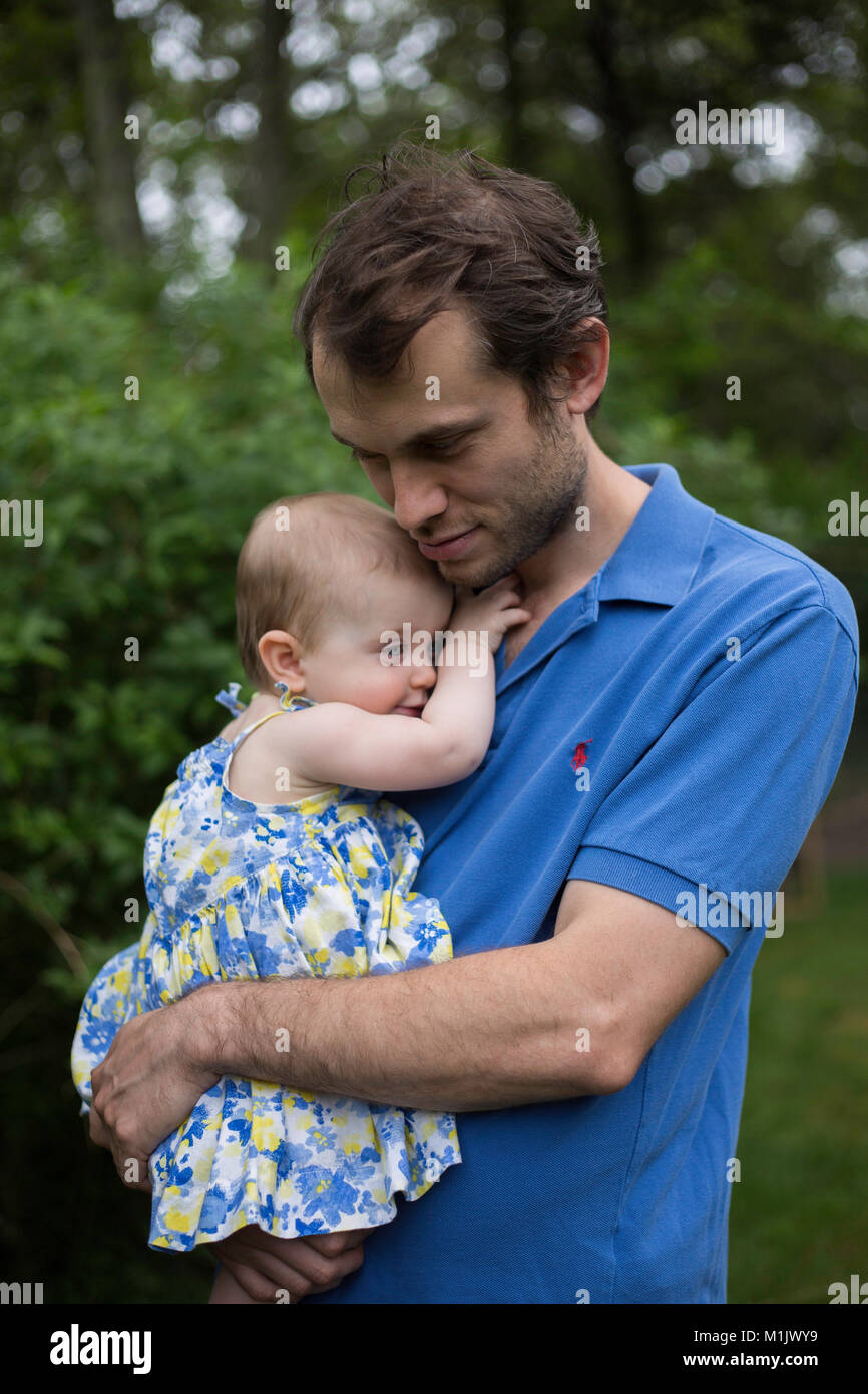 Man Holding Baby Outdoor Stock Photo - Alamy
