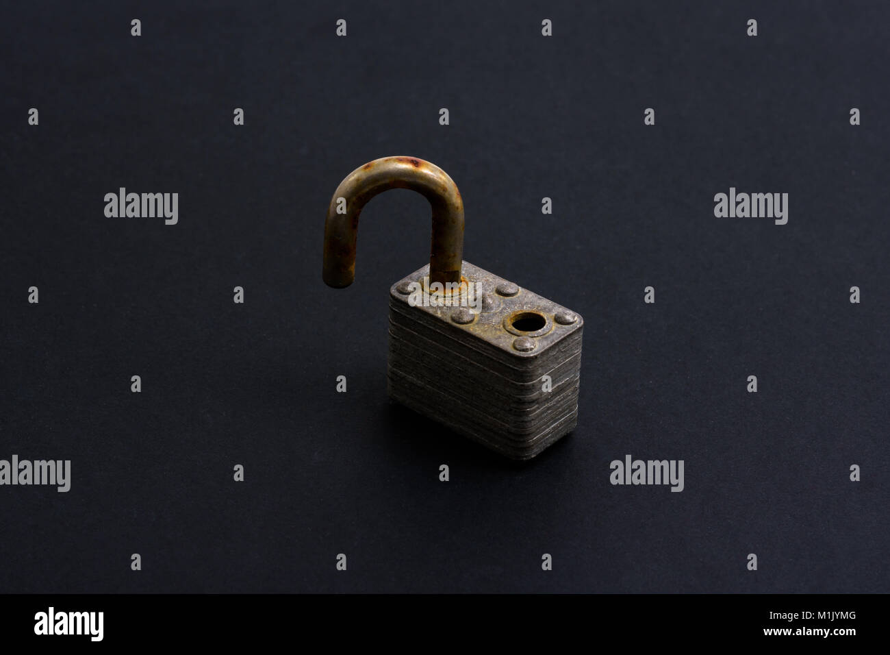 Padlock isolated on a black background Stock Photo - Alamy