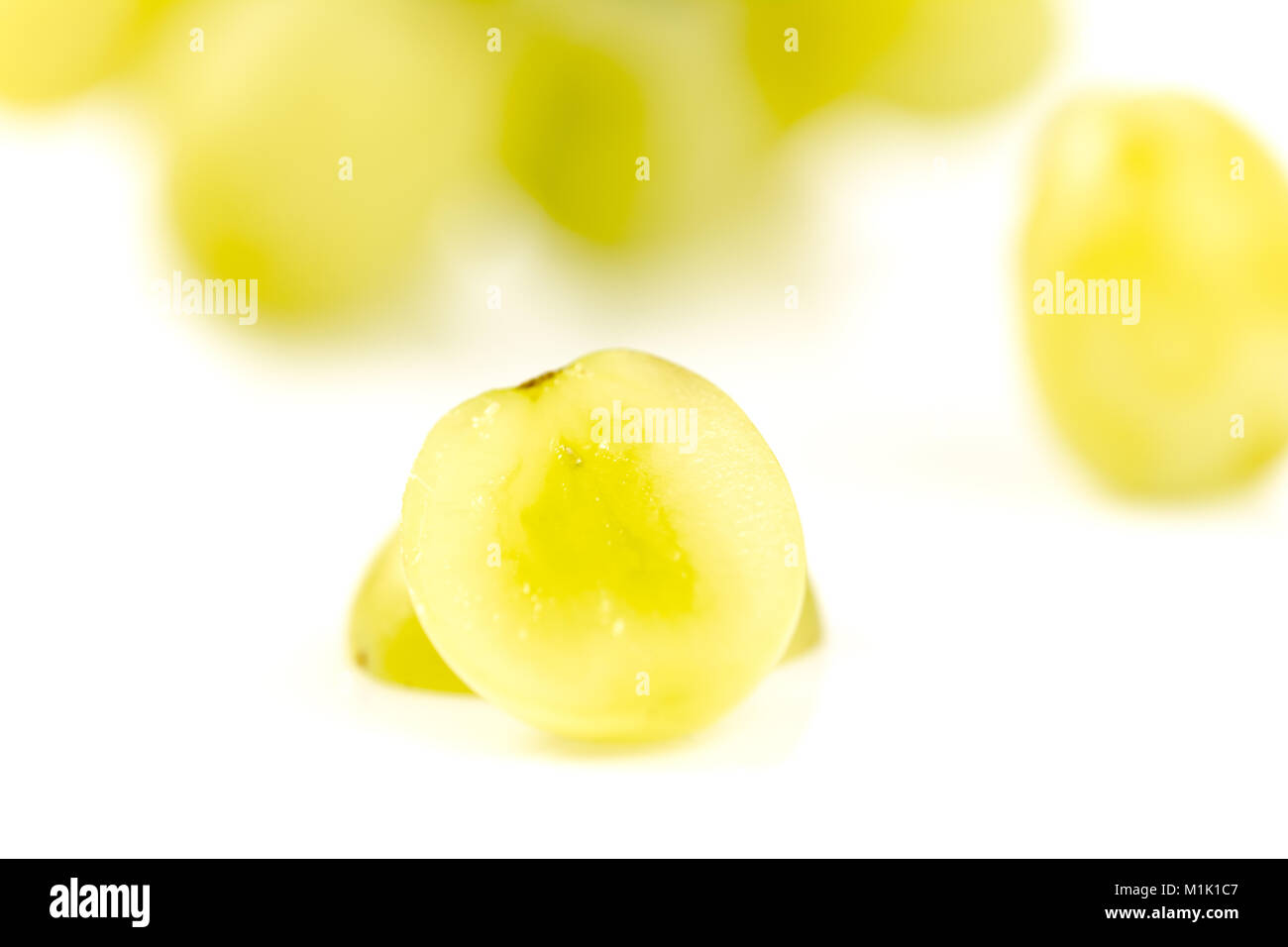 Green grapes without seed isolated on white background Stock Photo - Alamy