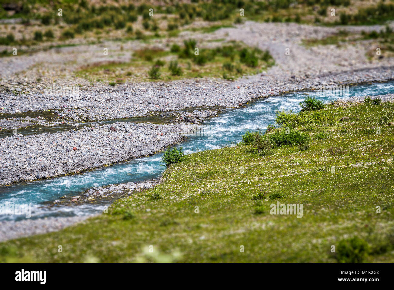 A small blue river flows in the mountainous country of Georgia Stock ...