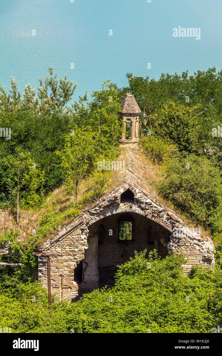 An old abandoned ruined church, overgrown with plants Stock Photo - Alamy
