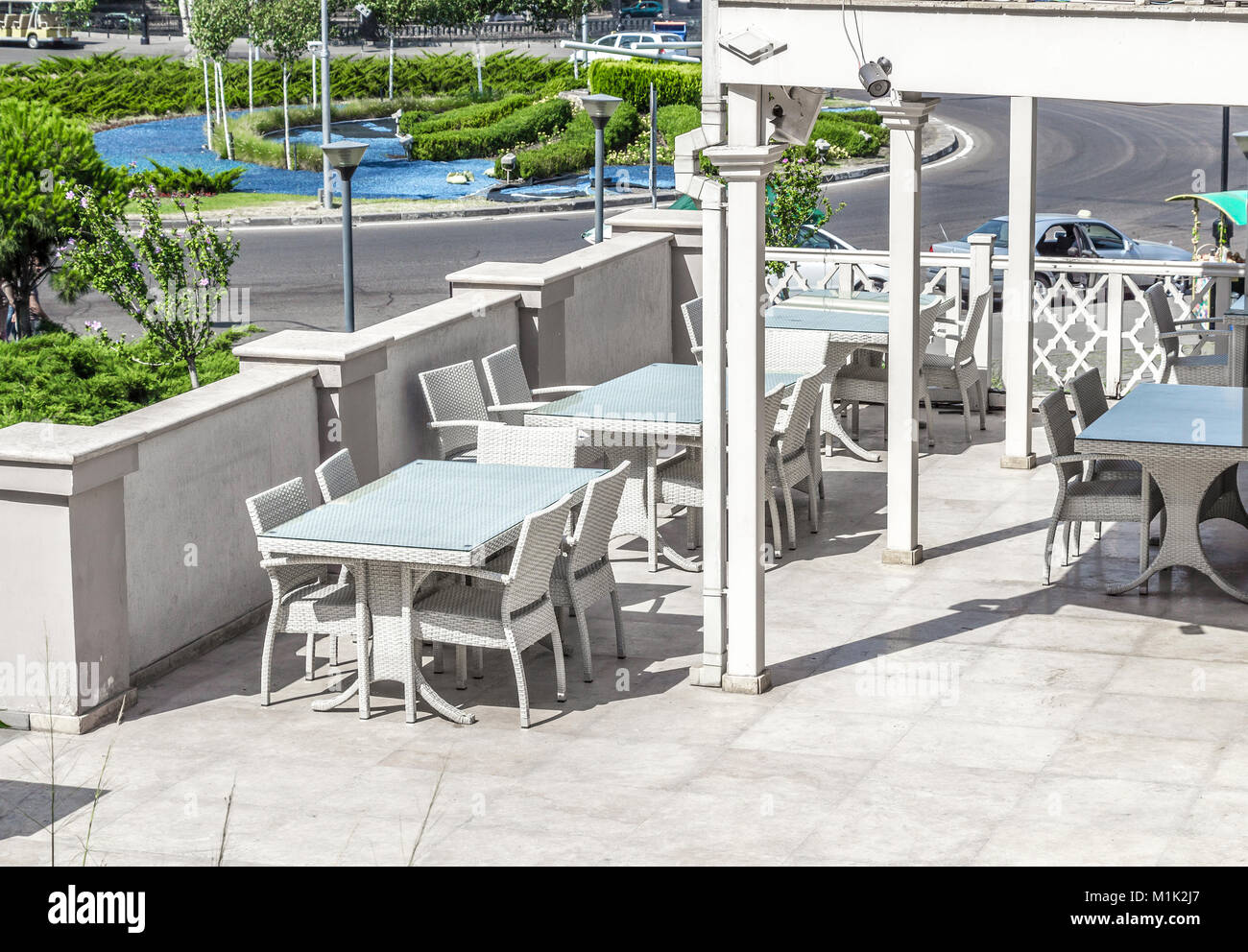 An outdoor cafe area near the road junction Stock Photo - Alamy