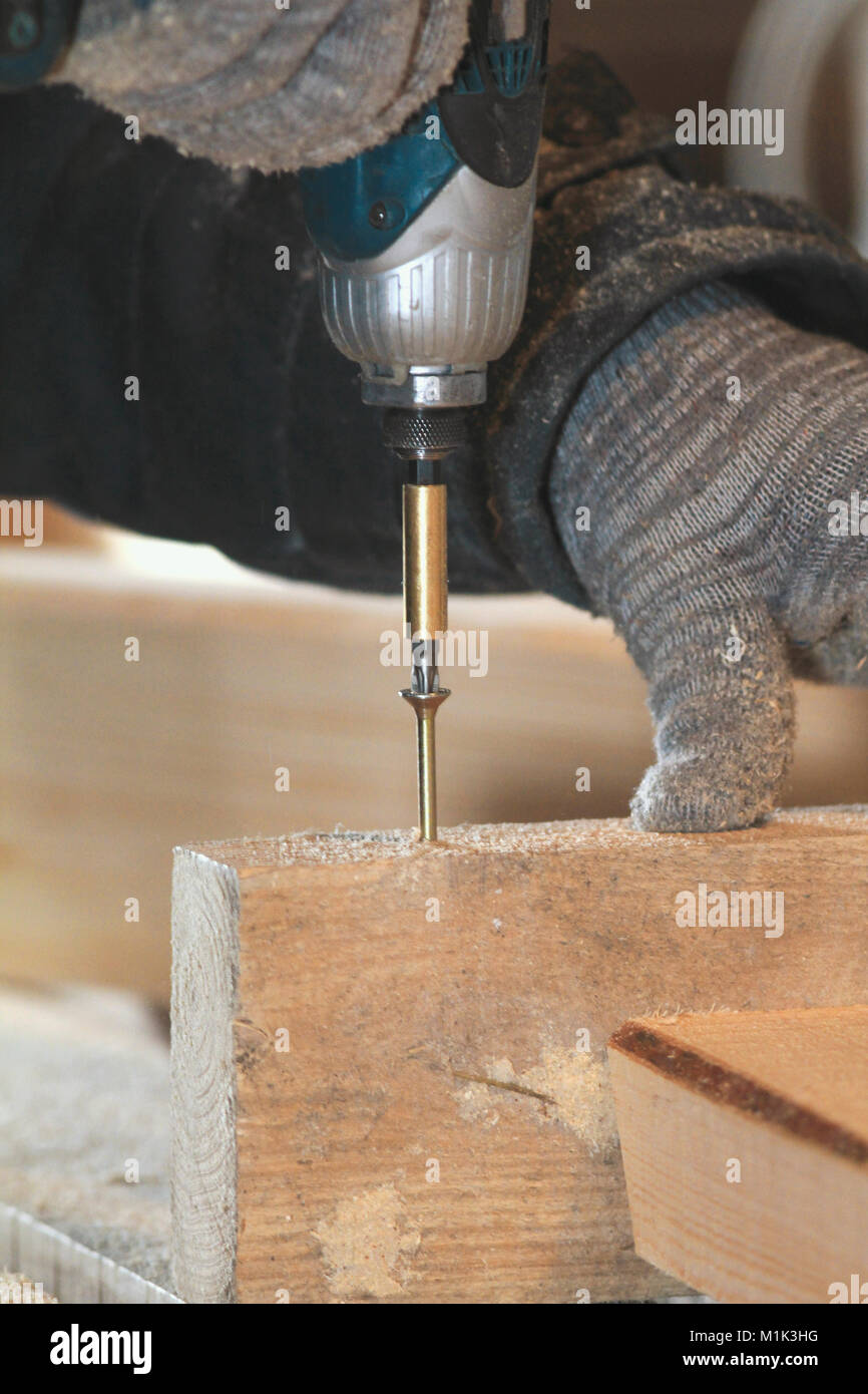 Close up of a carpenter holding a hand drill hi-res stock photography ...