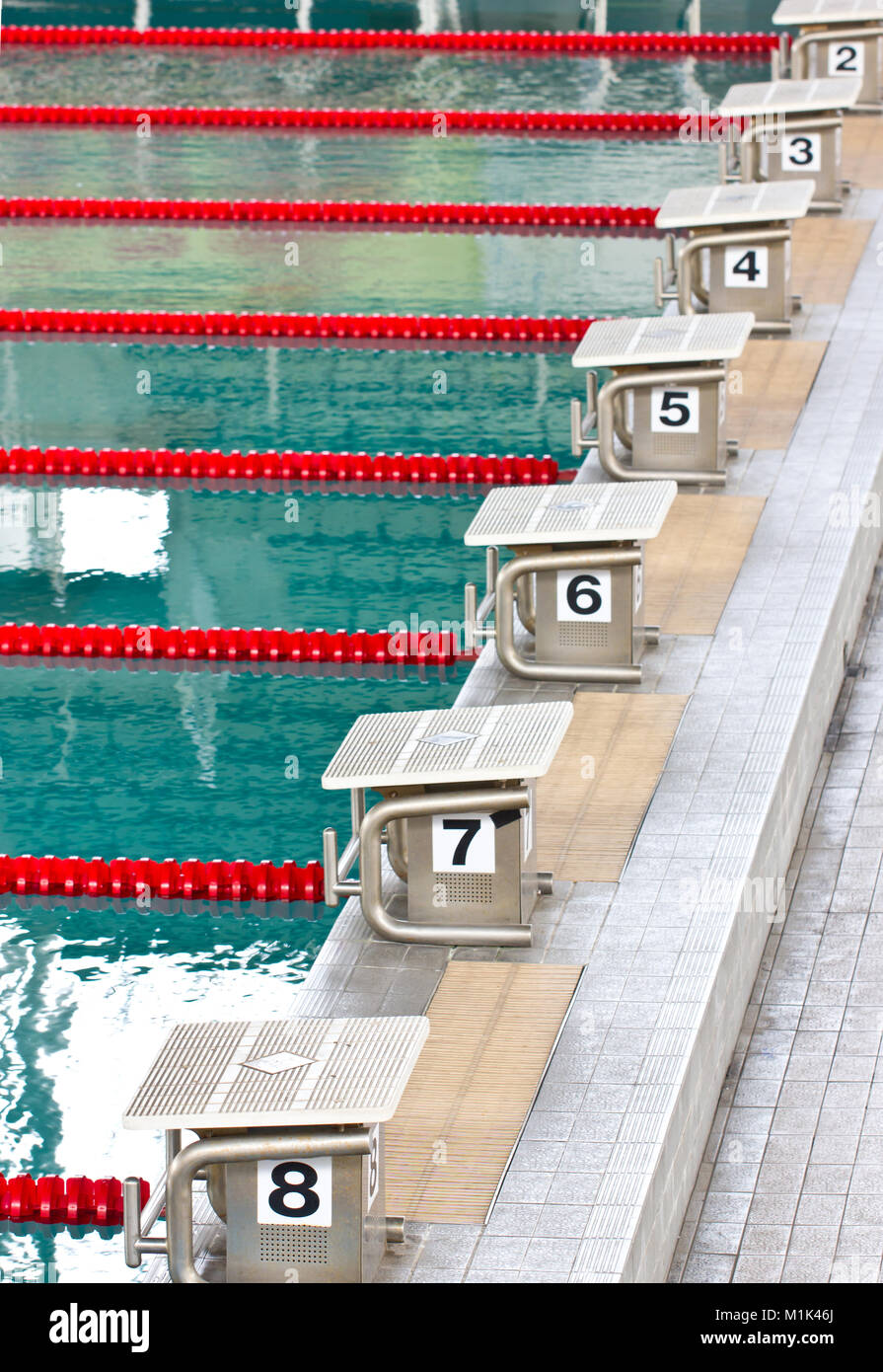 Empty swimming pool with starting block Stock Photo - Alamy