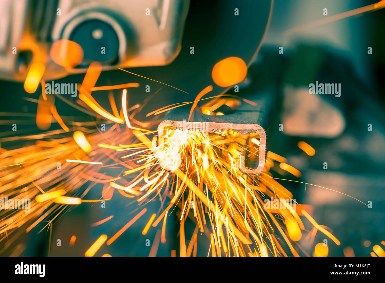 Orange spark flying from metal being cut with electric grinder Stock ...