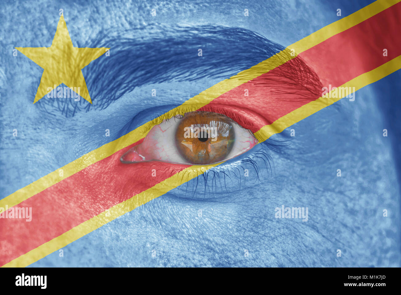 Human face and eye painted with flag of Congo Stock Photo - Alamy