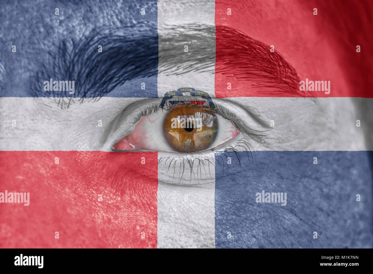 Human face and eye painted with flag of Dominican Republic Stock Photo ...