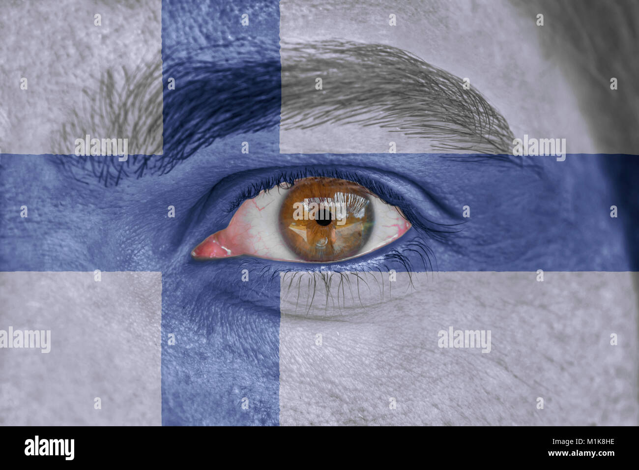 Human face and eye painted with flag of Finland Stock Photo - Alamy