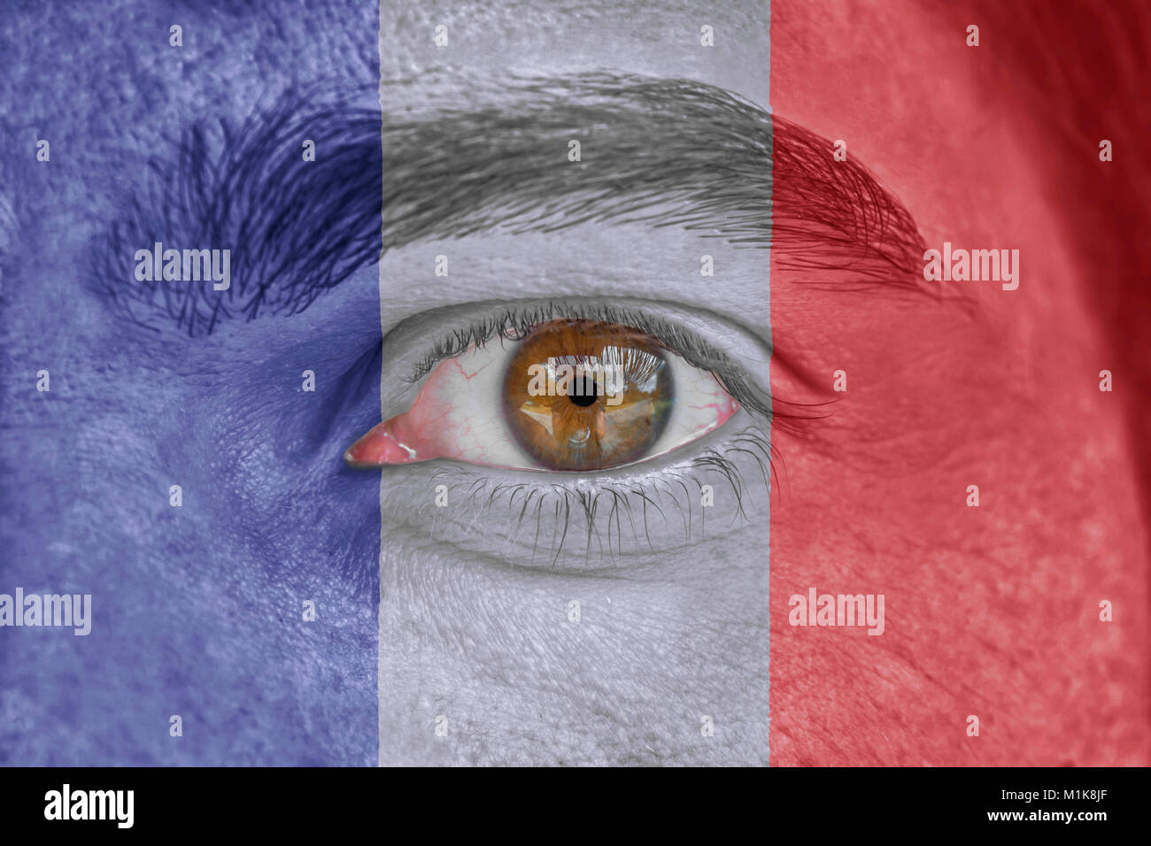 Human face and eye painted with flag of France Stock Photo - Alamy