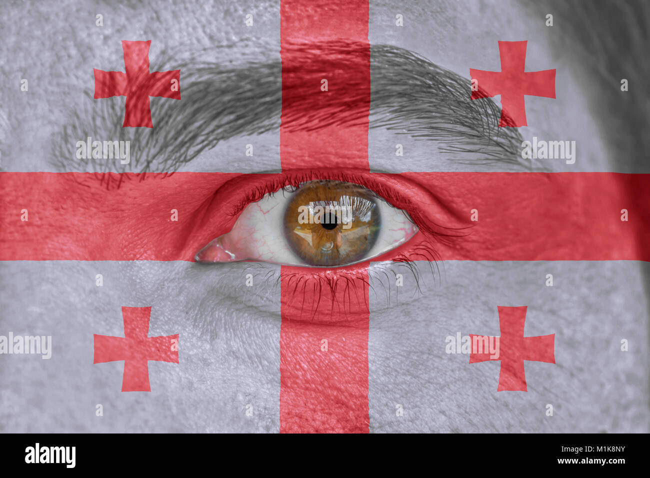 Human face and eye painted with flag of Georgia Stock Photo - Alamy