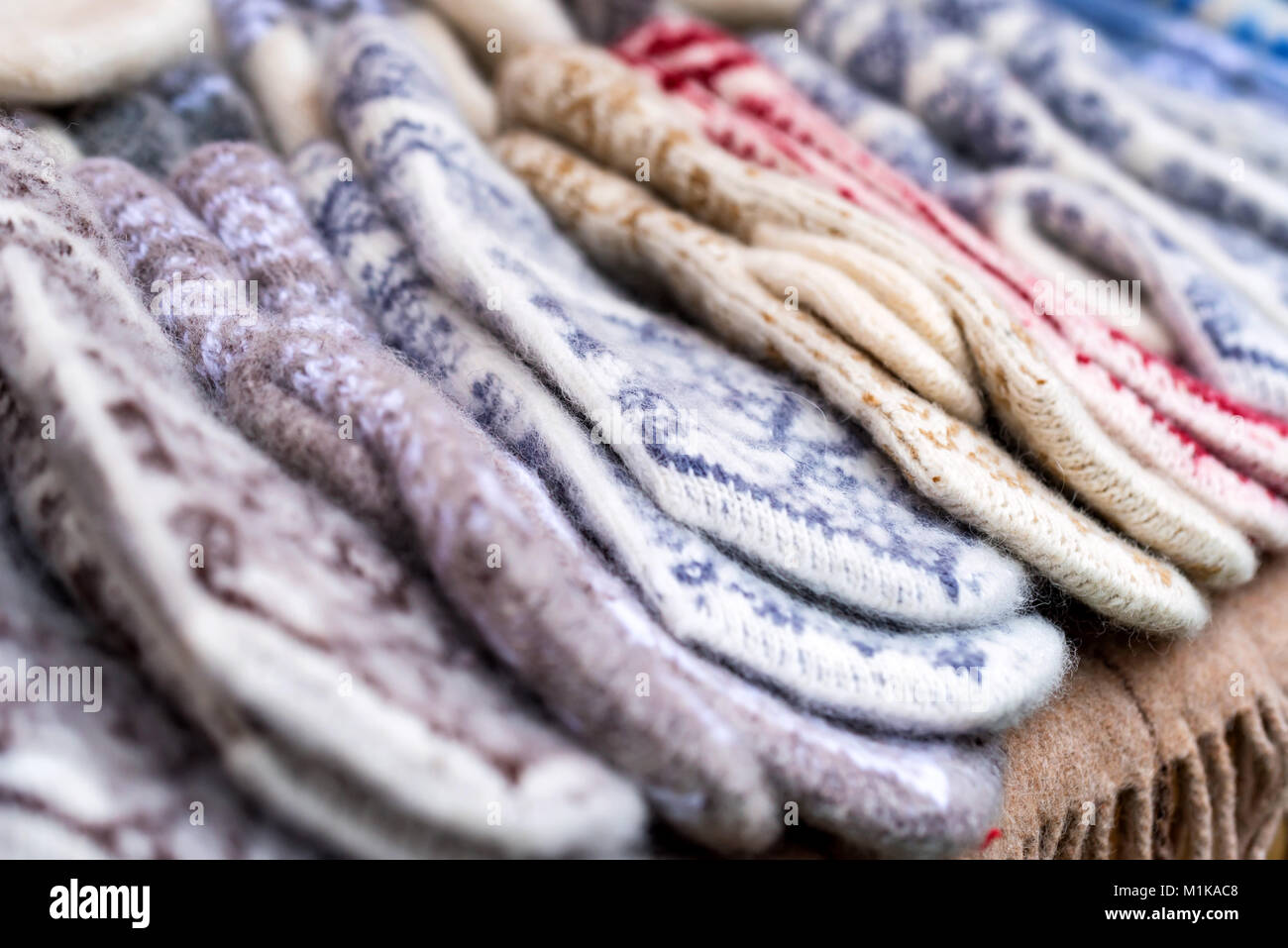 Bunch of handmade colorful woolen mittens Stock Photo - Alamy
