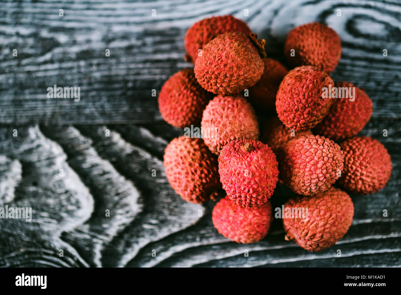 Top view lychee fruit on wooden background Stock Photo - Alamy